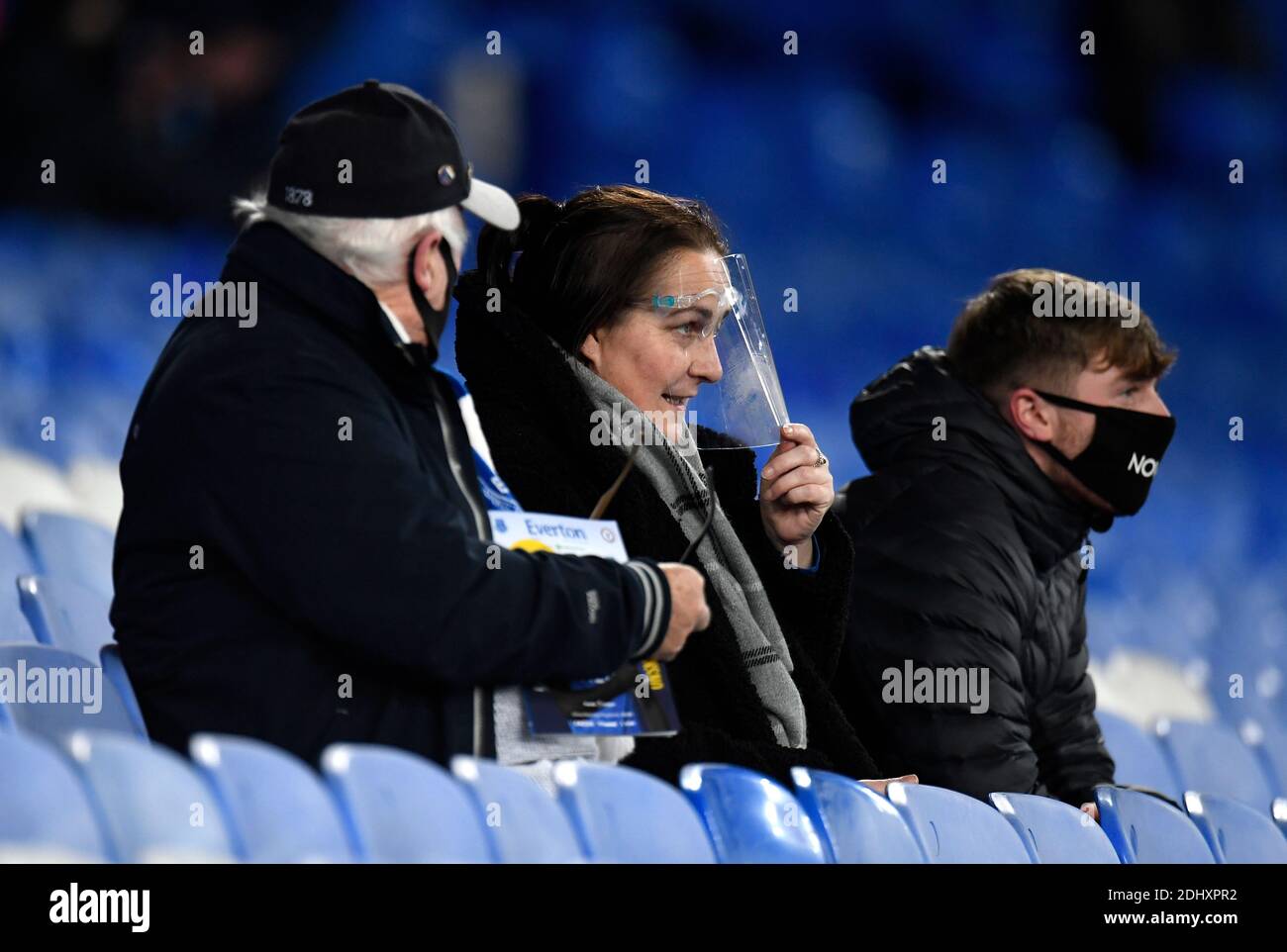 Everton fans wearing face masks take their seats before the Premier ...