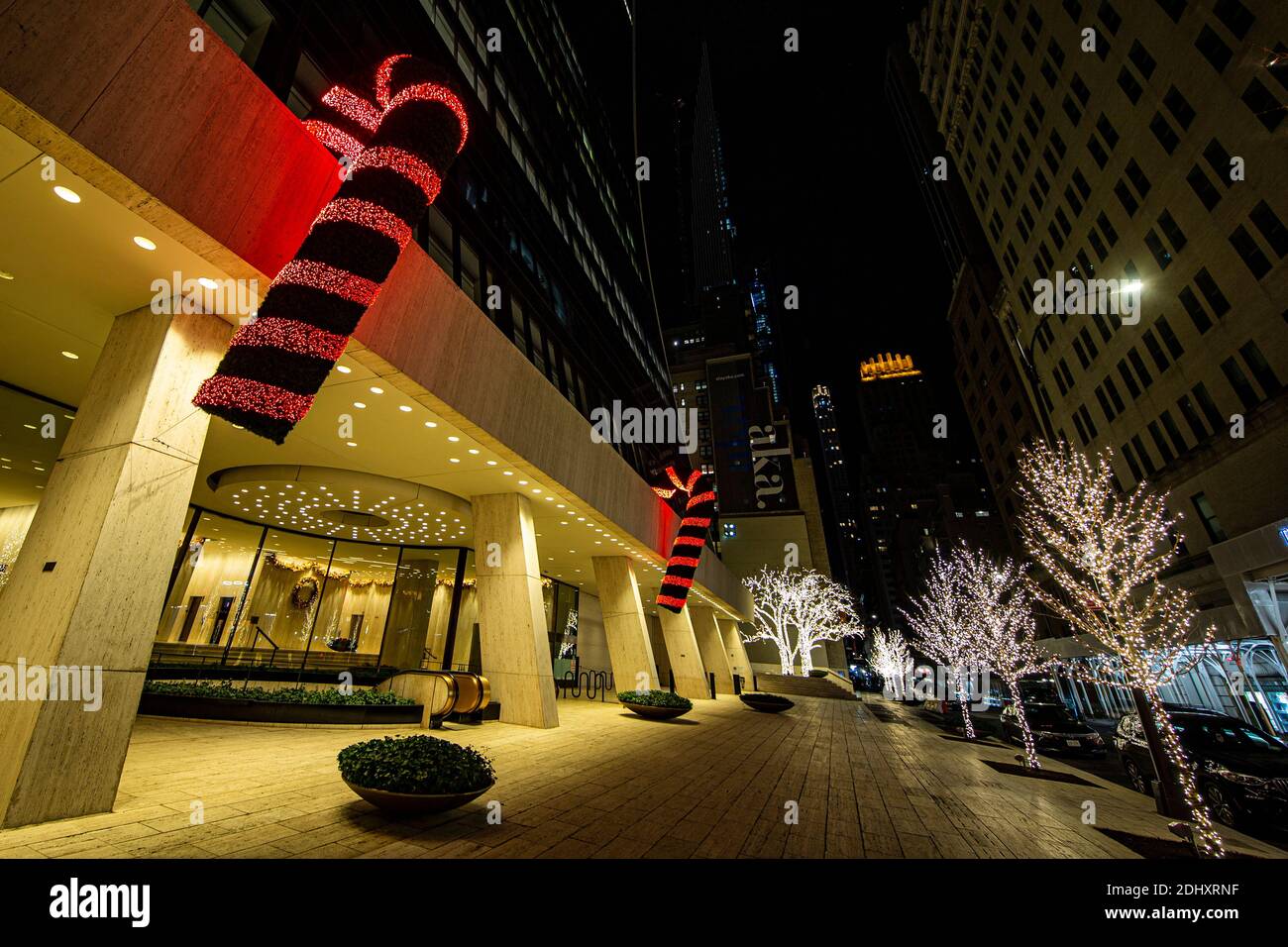 Giant candy canes hang outside an office building on W. 58th St. in New ...