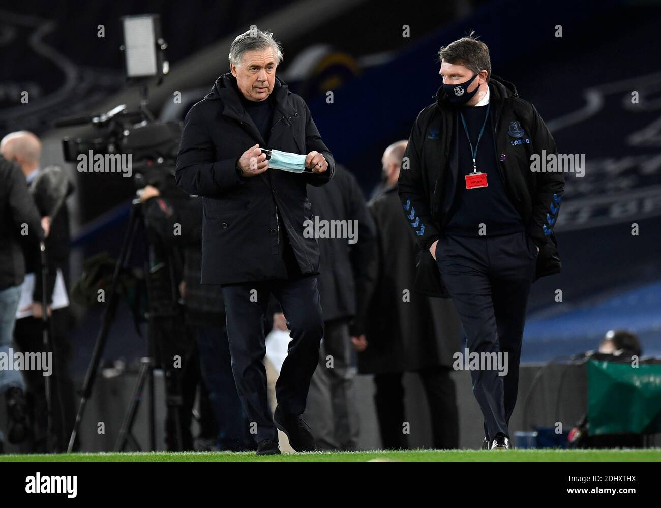Everton manager Carlo Ancelotti holding a face mask before the Premier ...