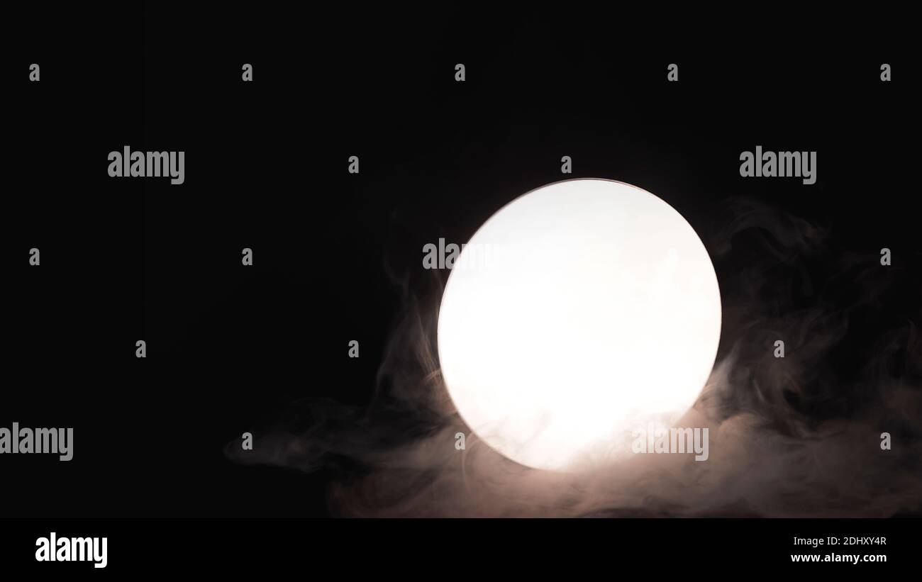 Surreal smoke with reflection in a round mirror Stock Photo - Alamy