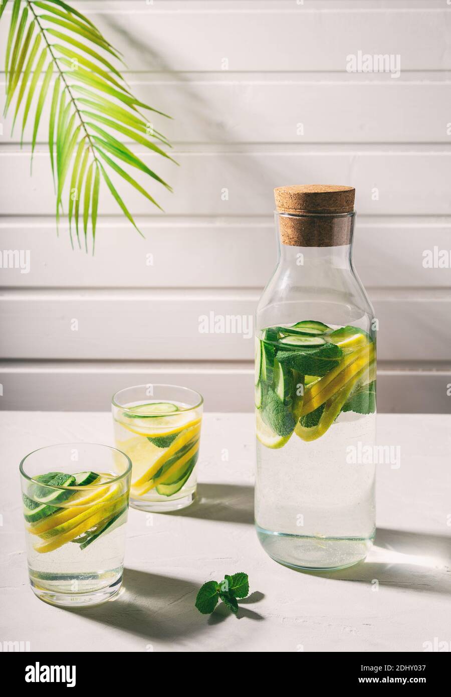 Sassy water for detox infused with lemon, cucumber and mint in glasses ...
