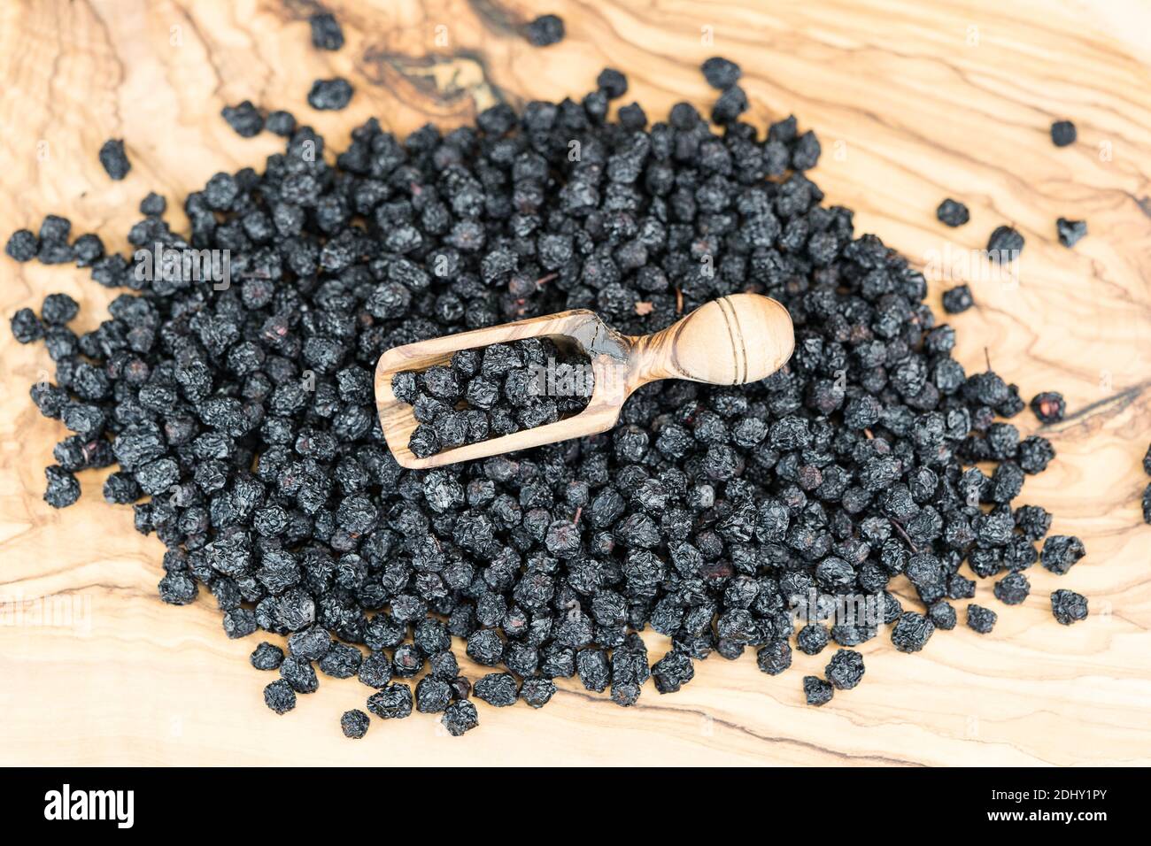 dried Black rowan aronia chokeberry on olive wood Stock Photo - Alamy