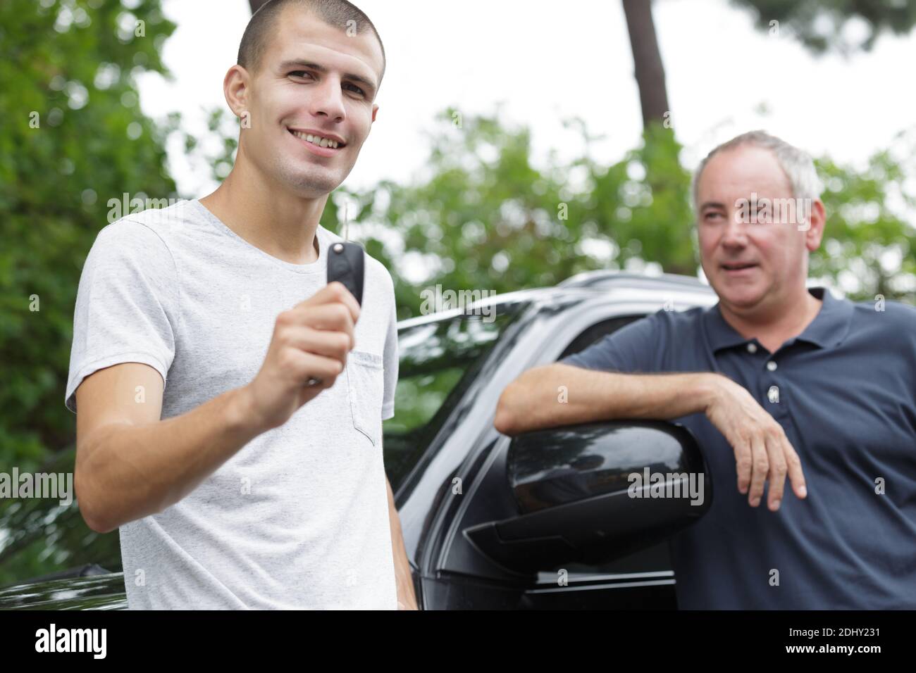 Father showing son drive hi-res stock photography and images - Alamy