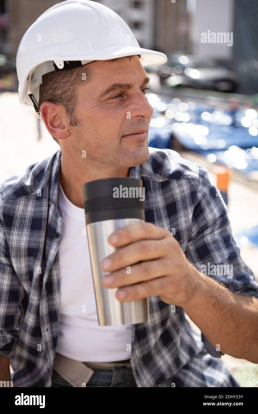 builder enjoys a coffee break Stock Photo - Alamy