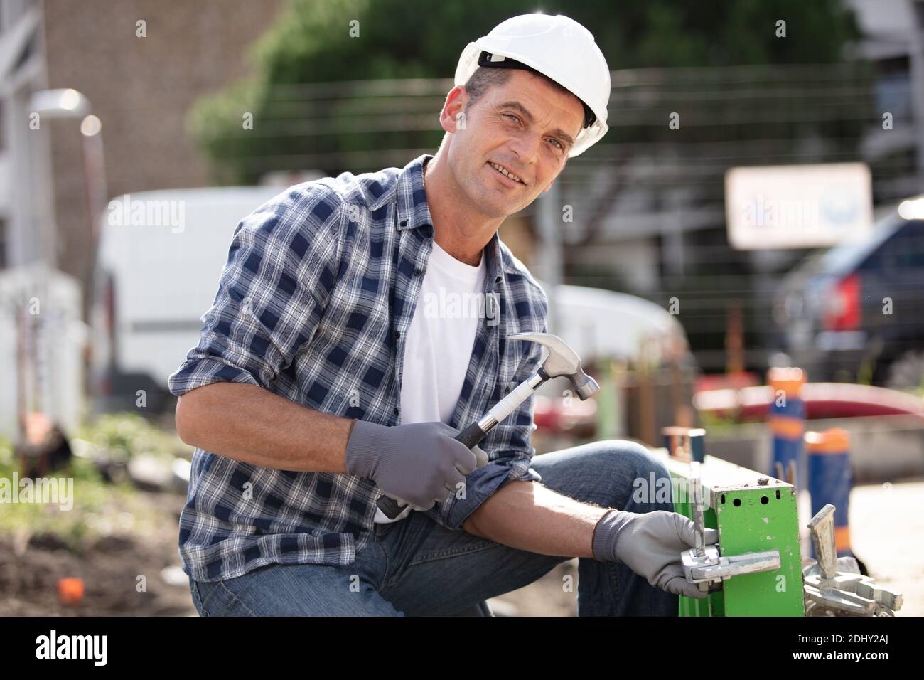 mature construction worker laying foundations Stock Photo - Alamy