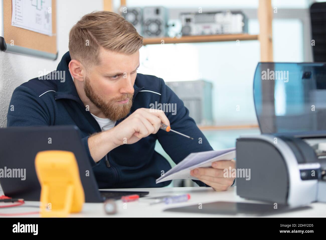 handsome technician repairing the computer Stock Photo - Alamy