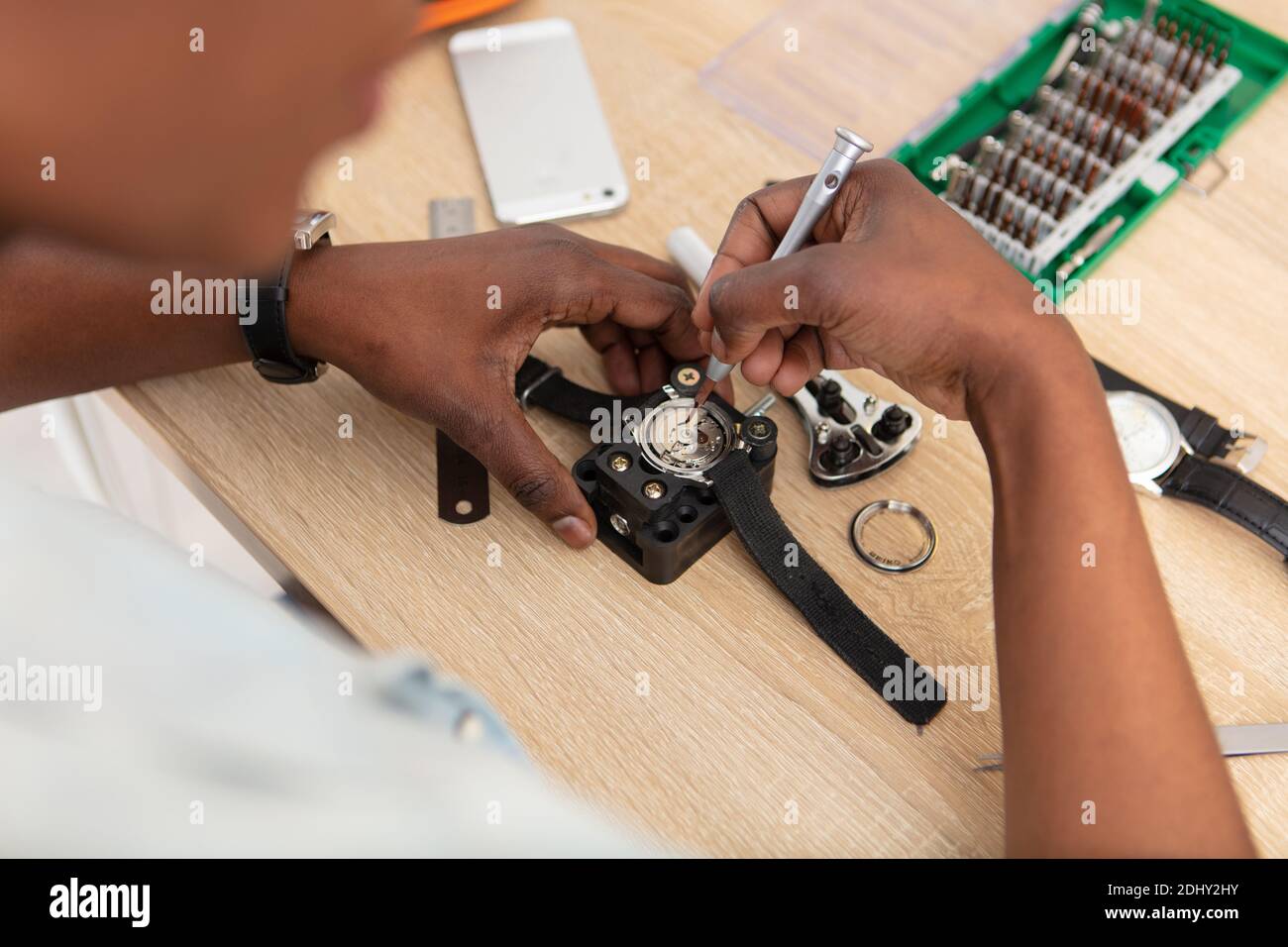watchmaker repairing wristwatch at working table Stock Photo - Alamy