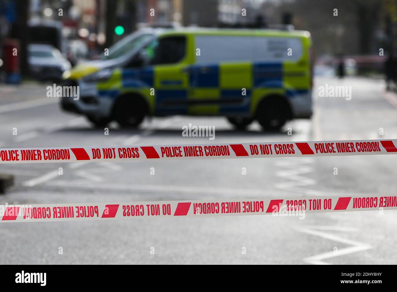 Police tapes are seen around a crime scene in London Stock Photo - Alamy