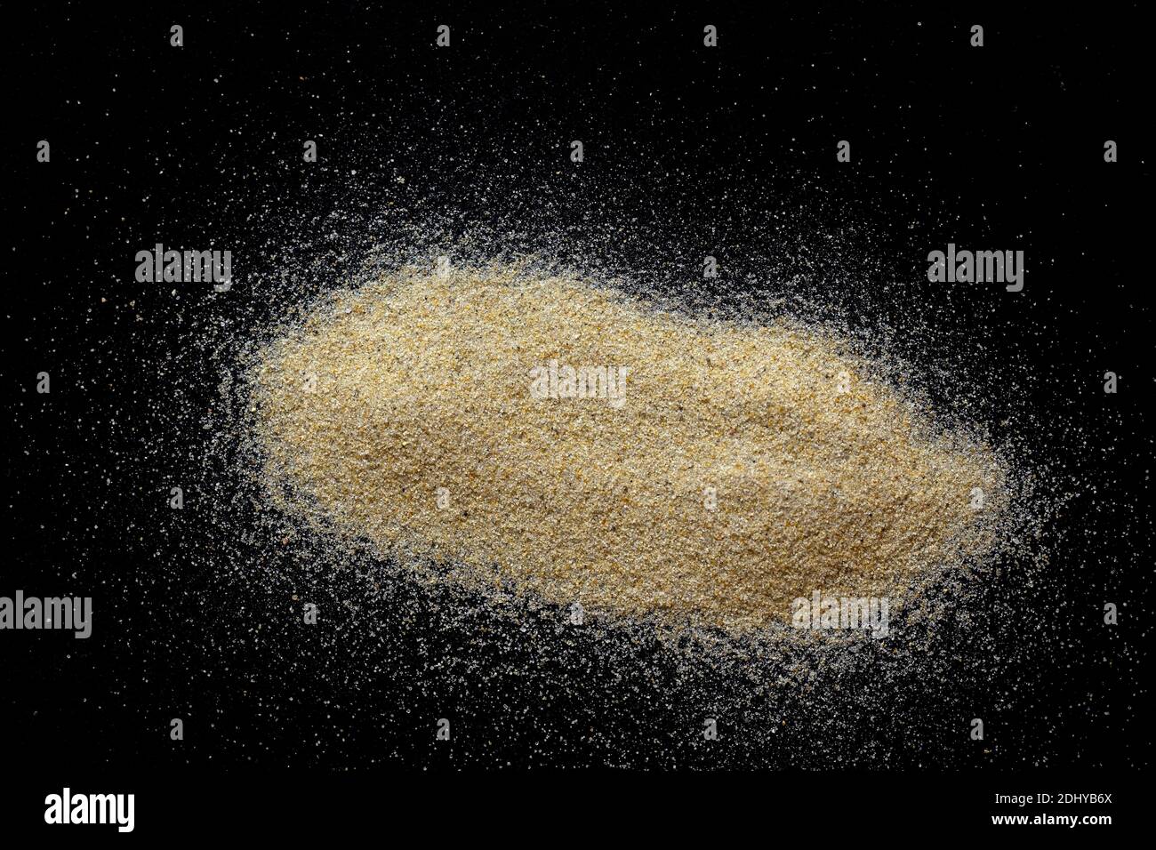 Sand heap on black background Stock Photo - Alamy