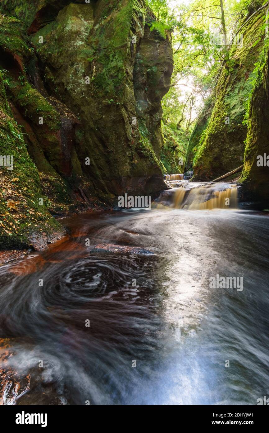 Red water stream in scotland with waterfall Stock Photo - Alamy