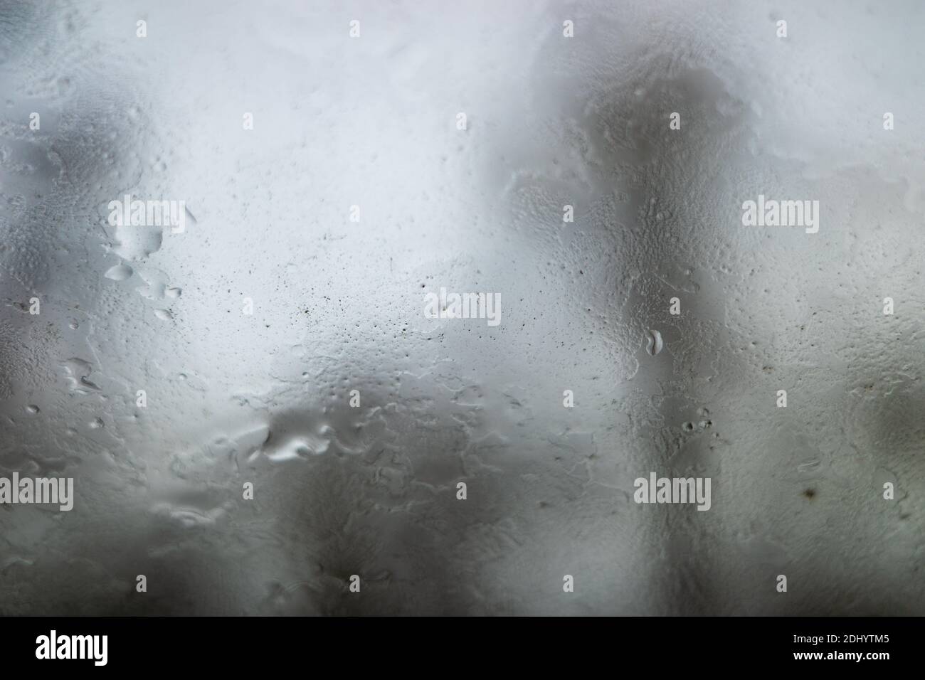 Selective focus and macro view of droplet of water, dew or stream on ...