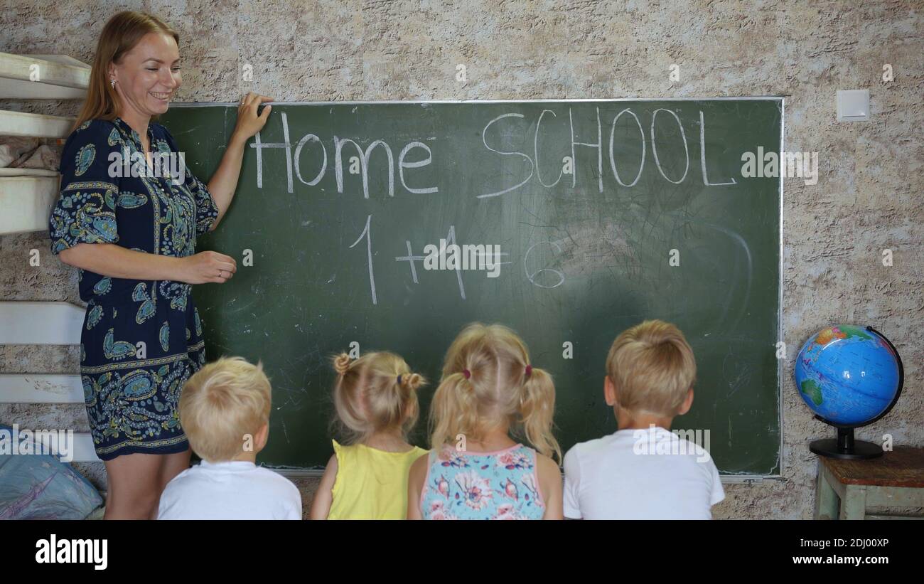 Home school concept. Mother give children a math lesson at the ...