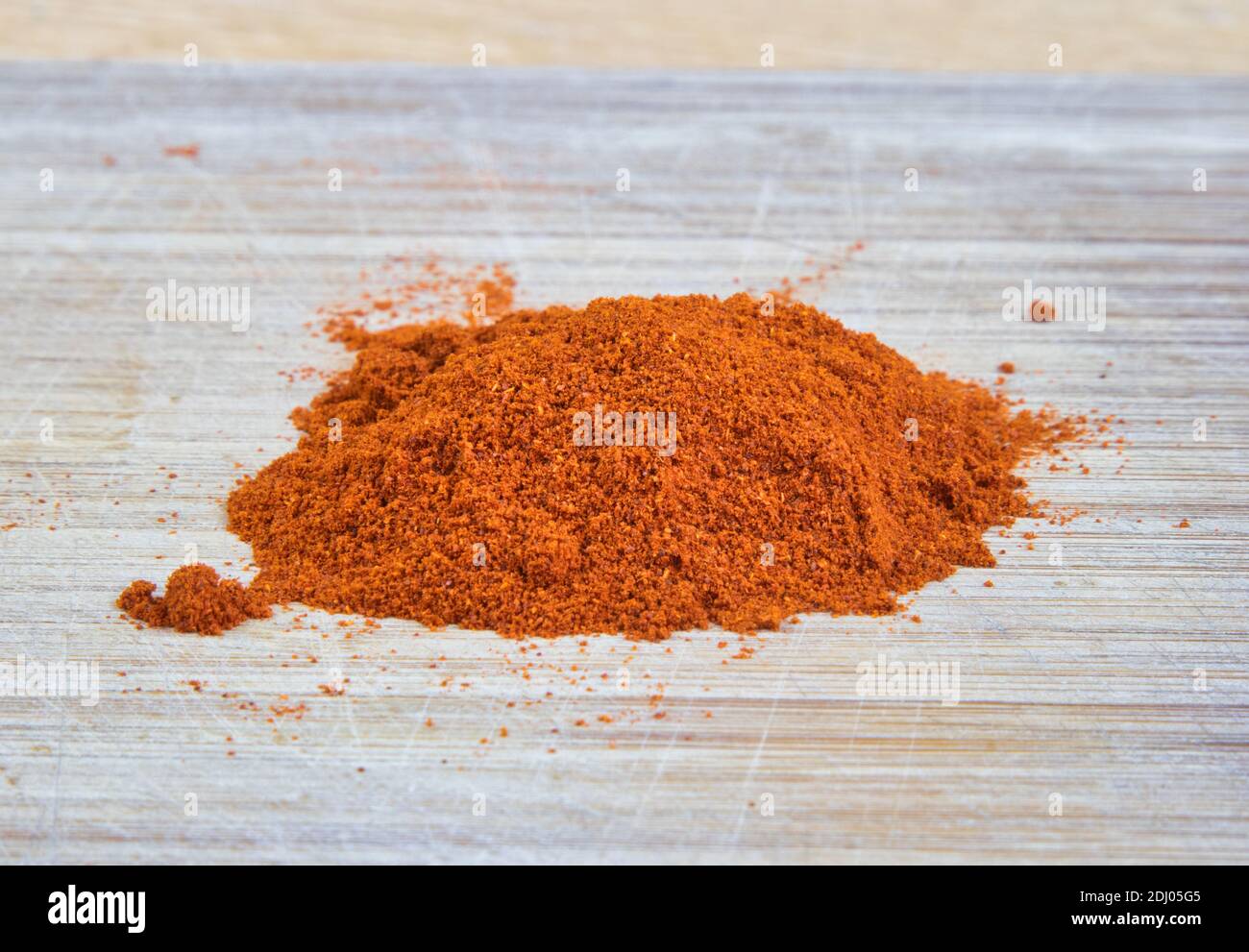A pile of freshly ground paprika on a cutting board Stock Photo - Alamy