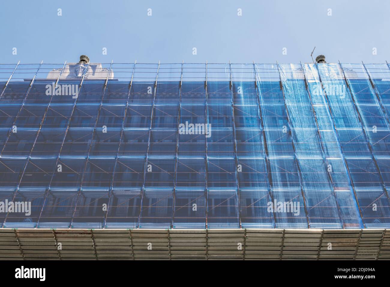 Palace in maintenance. Scaffolding, protection net and debris ...