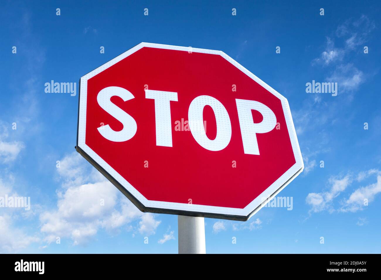 Roadside red stop sign on a cloudy background Stock Photo - Alamy