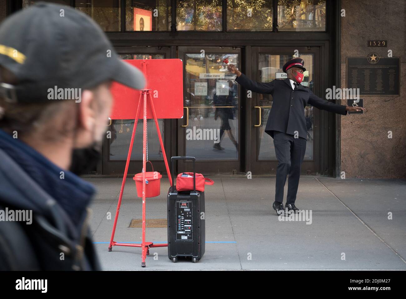 Manhattan, New York. December 11, 2020. A man walks in front of a ...