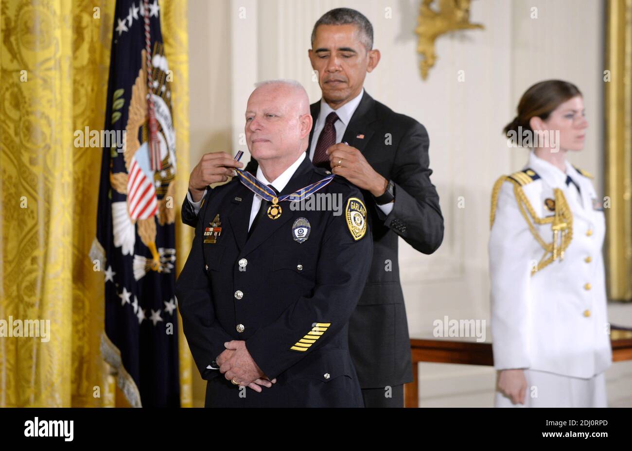 U.S. President Barack Obama awards Garland Police Officer Gregory ...