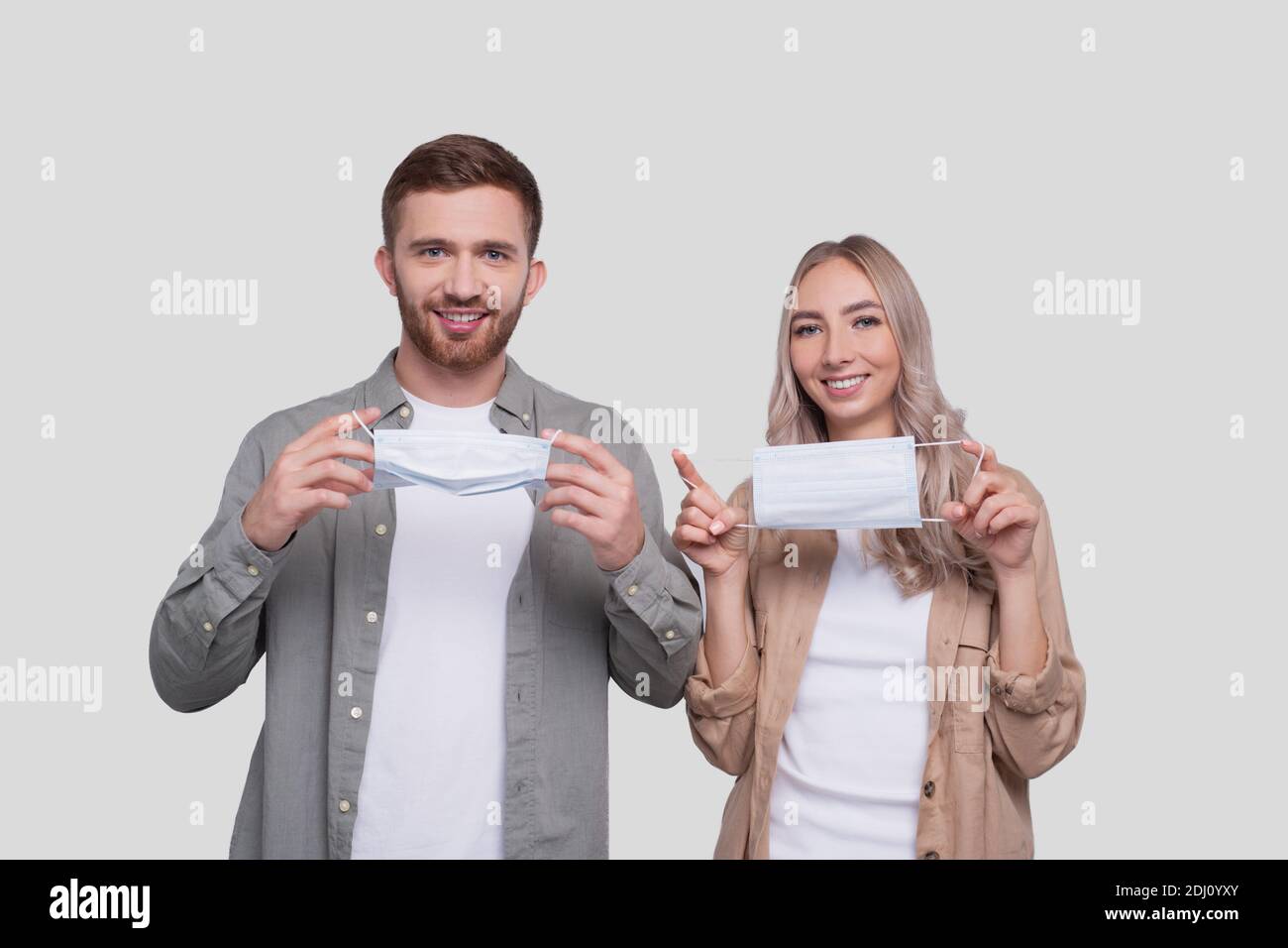 Couple Puts on Medical Mask Standing Isolated. Health protection ...