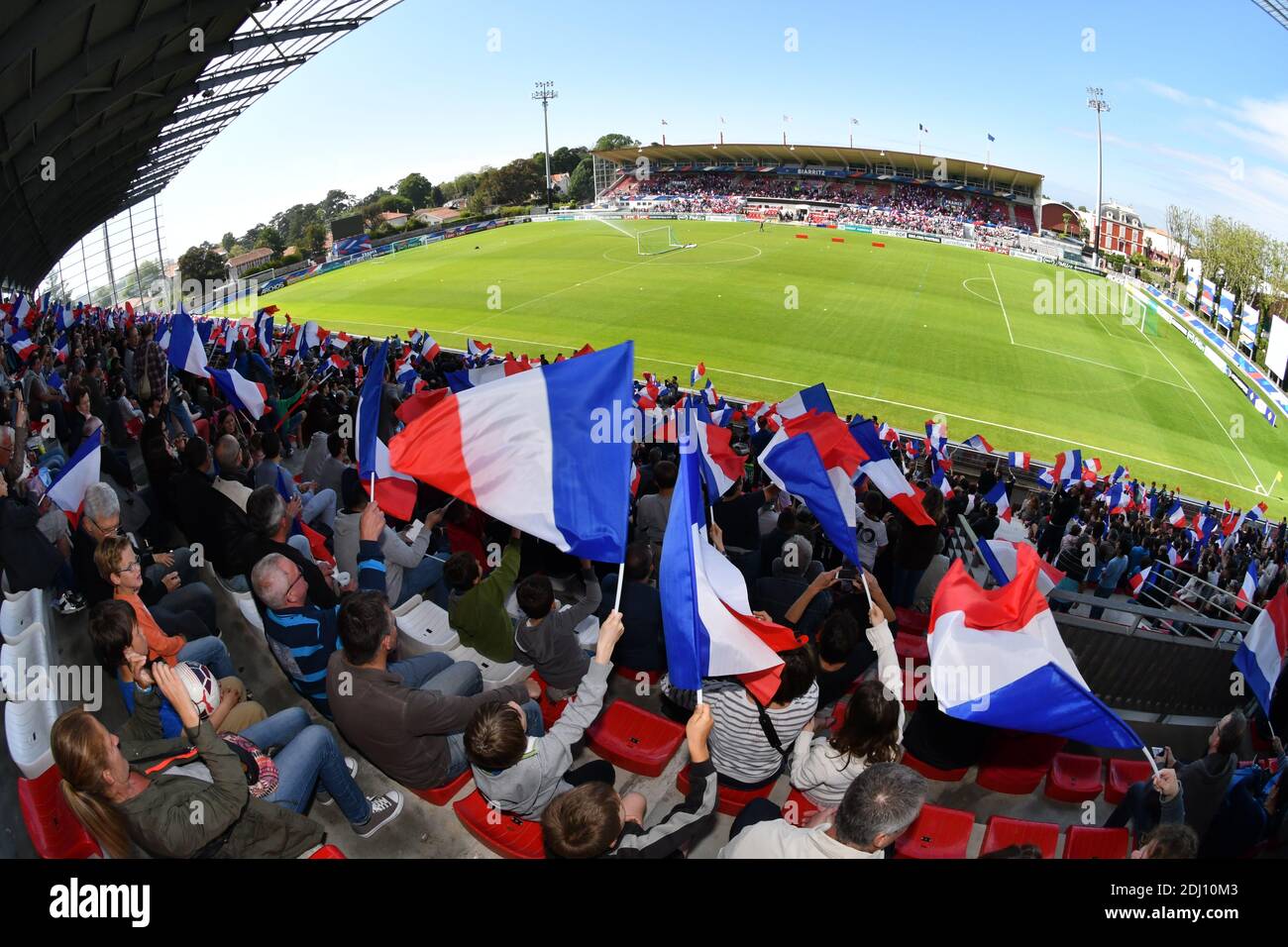 France's supporters wave French national flags during a training ...