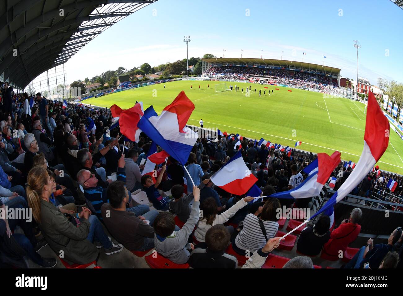 France's supporters wave French national flags during a training ...