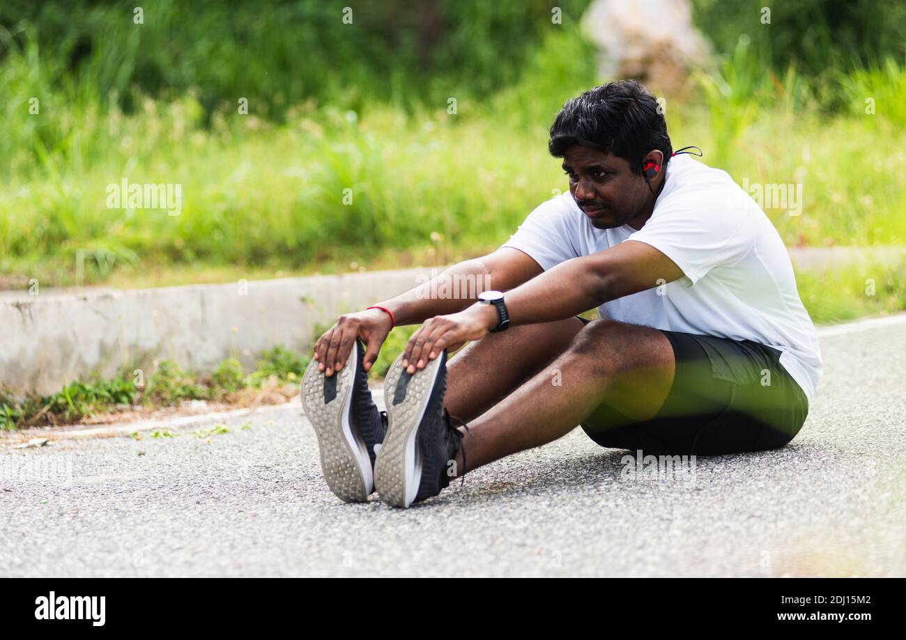 Close up Asian young athlete sport runner black man wear watch he ...