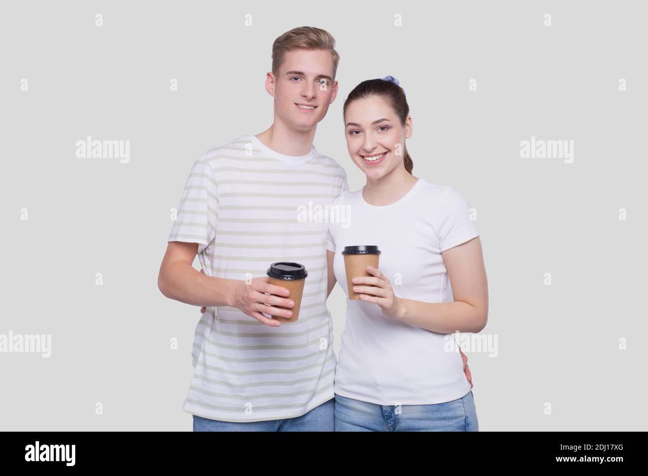 Couple Holding Coffee Cups Isolated. Couple Standing and Holding Coffee ...