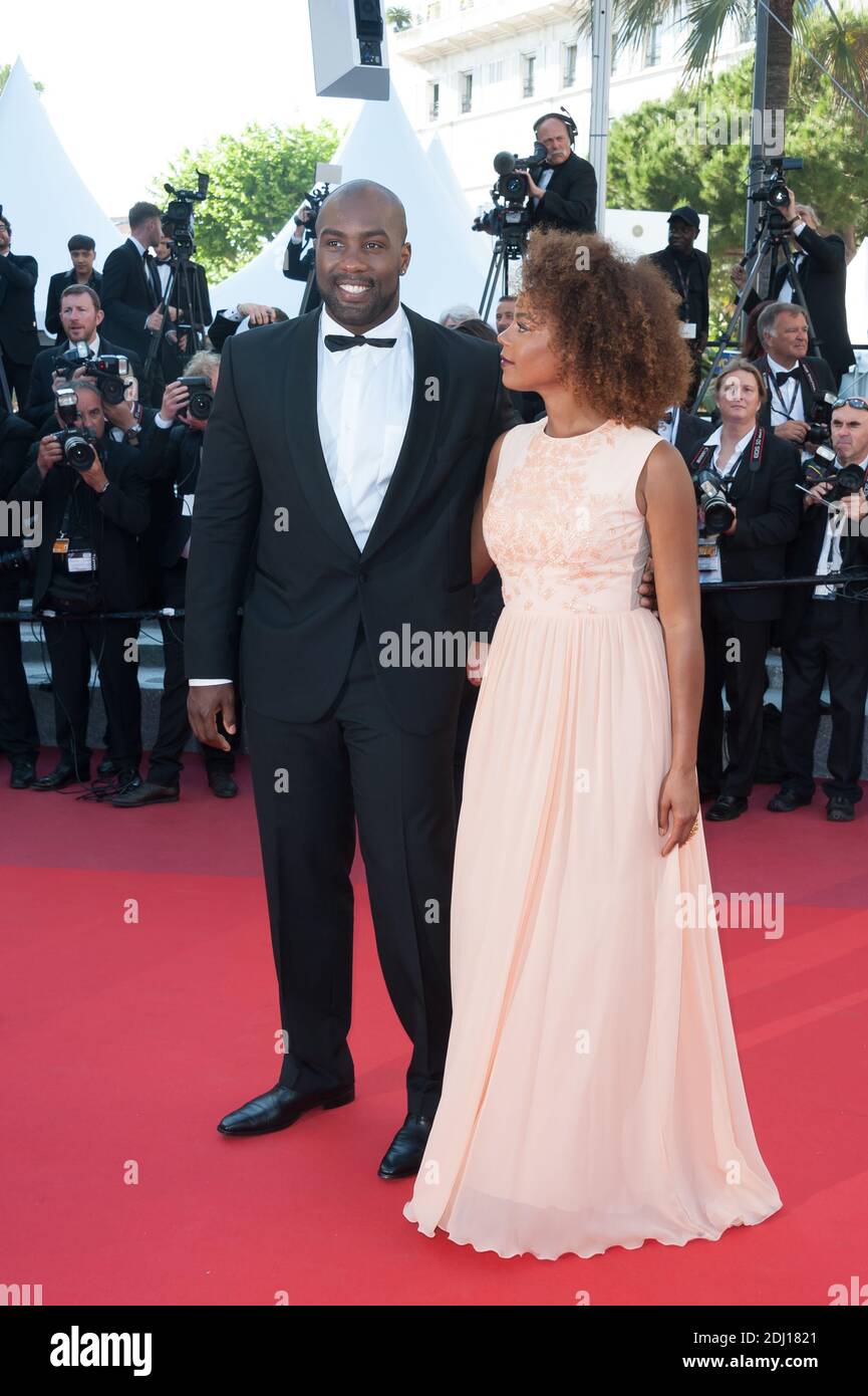 Teddy Riner and his partner Luthna arriving on the red carpet of 'Elle ...