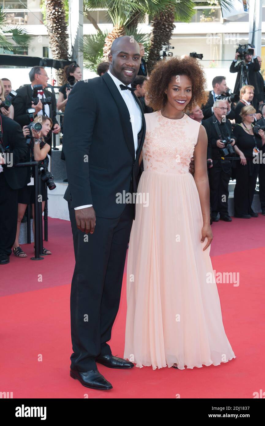 Teddy Riner and his partner Luthna arriving on the red carpet of 'Elle ...