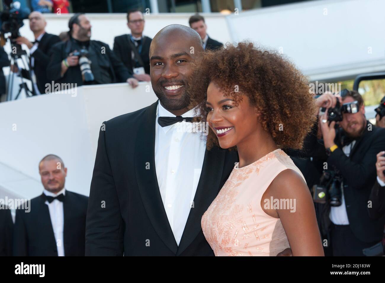 Teddy Riner and his partner Luthna arriving on the red carpet of 'Elle ...