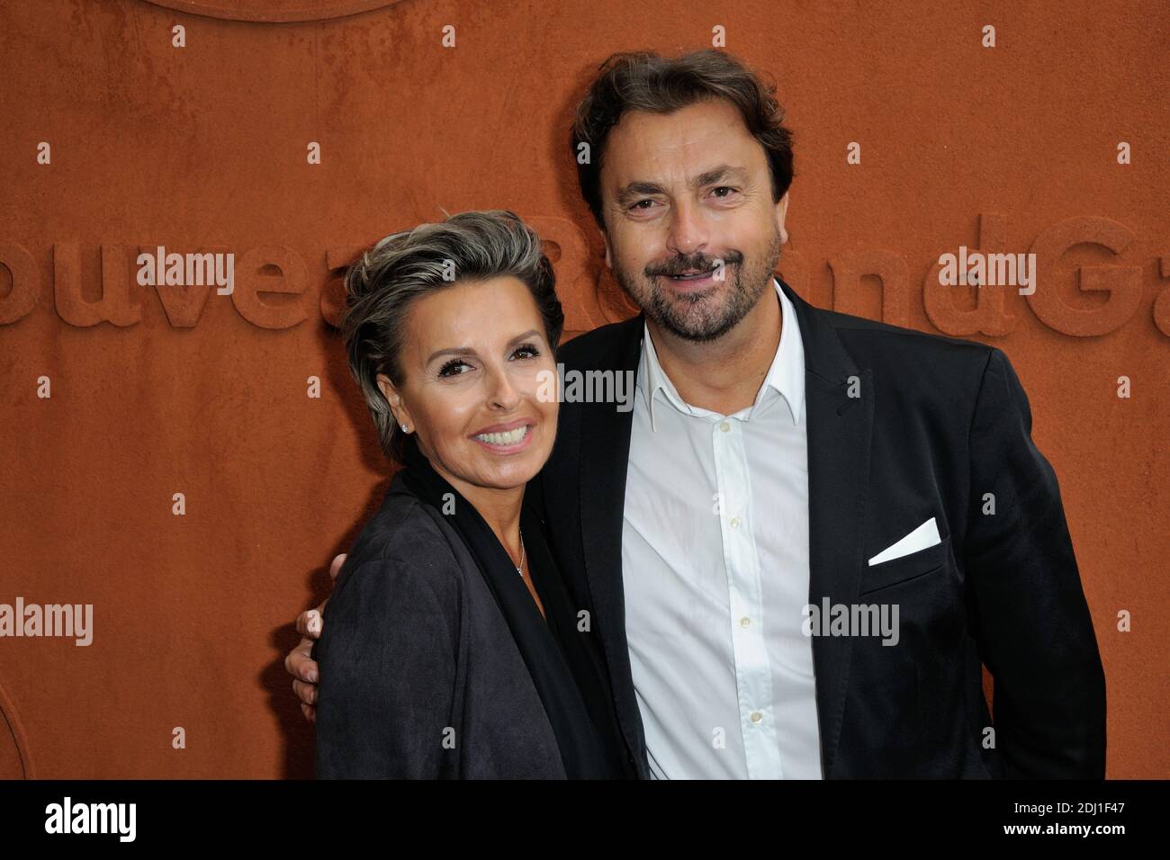 Henri Leconte and Maria Dowlatshahi posing at the Village during French ...
