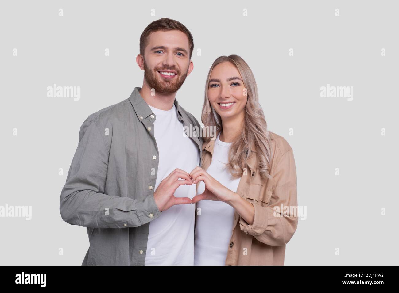 Couple Showing Heart Sign. Couple Standing Showing Love Sign ...