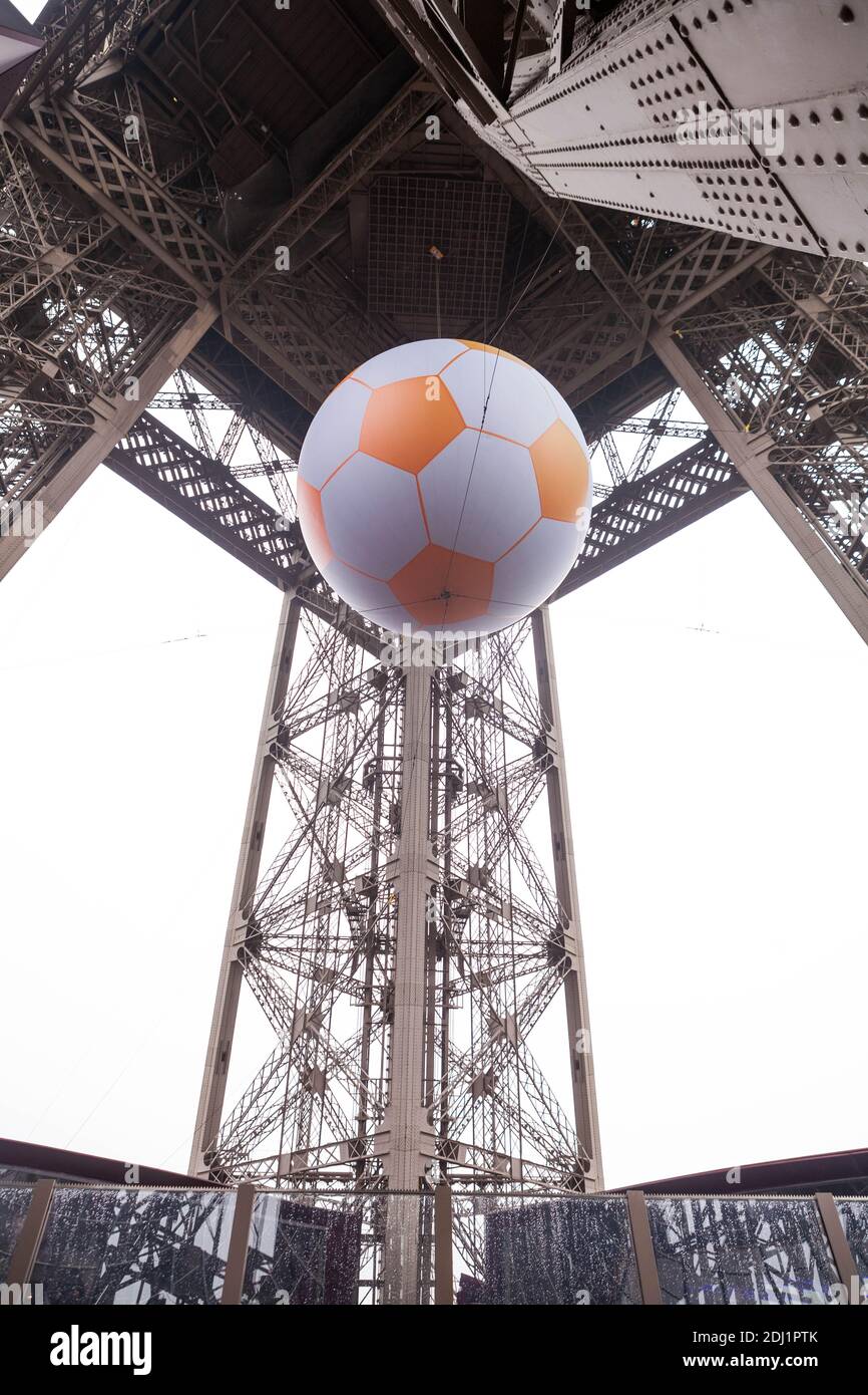 An inflated ball hung inside the Eiffel Tower next to the under ...