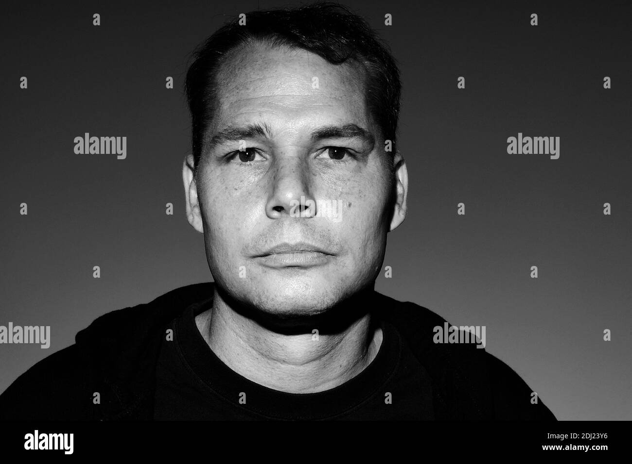 Streetartist OBEY (Shepard Fairey) posing before installing his new ...