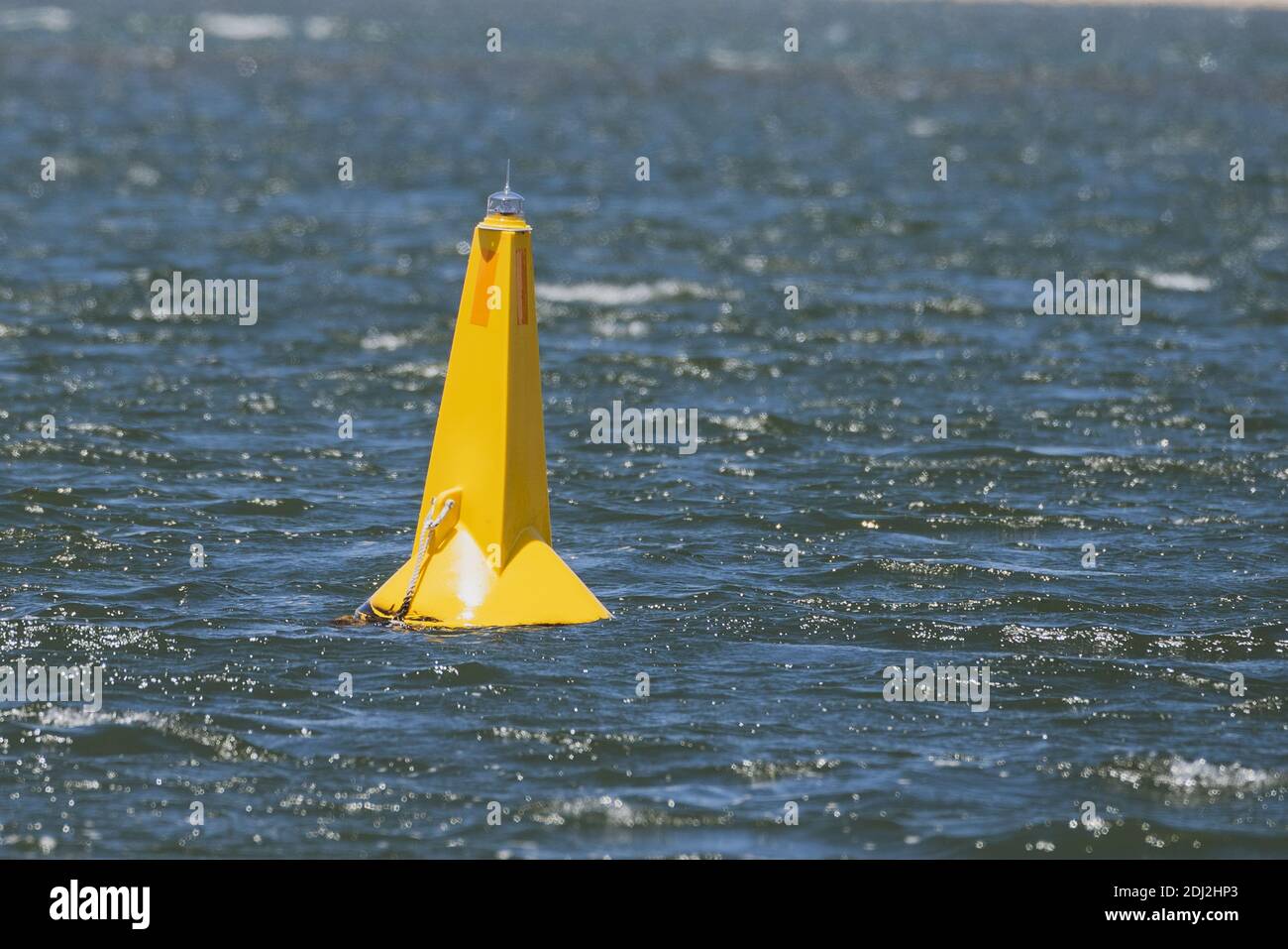 Yellow marker for boat navigation Stock Photo - Alamy