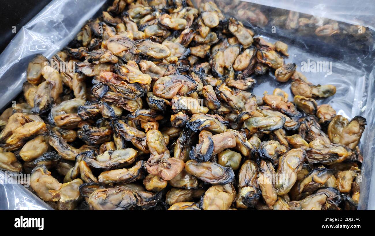 Dried oysters display on market for sell Stock Photo - Alamy