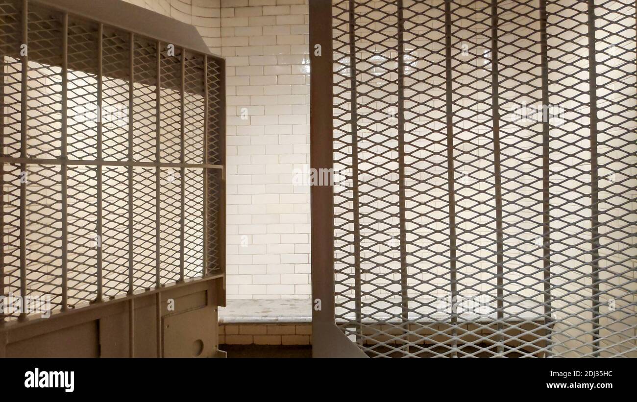 Prison with bars and open cell door in Singapore Stock Photo - Alamy