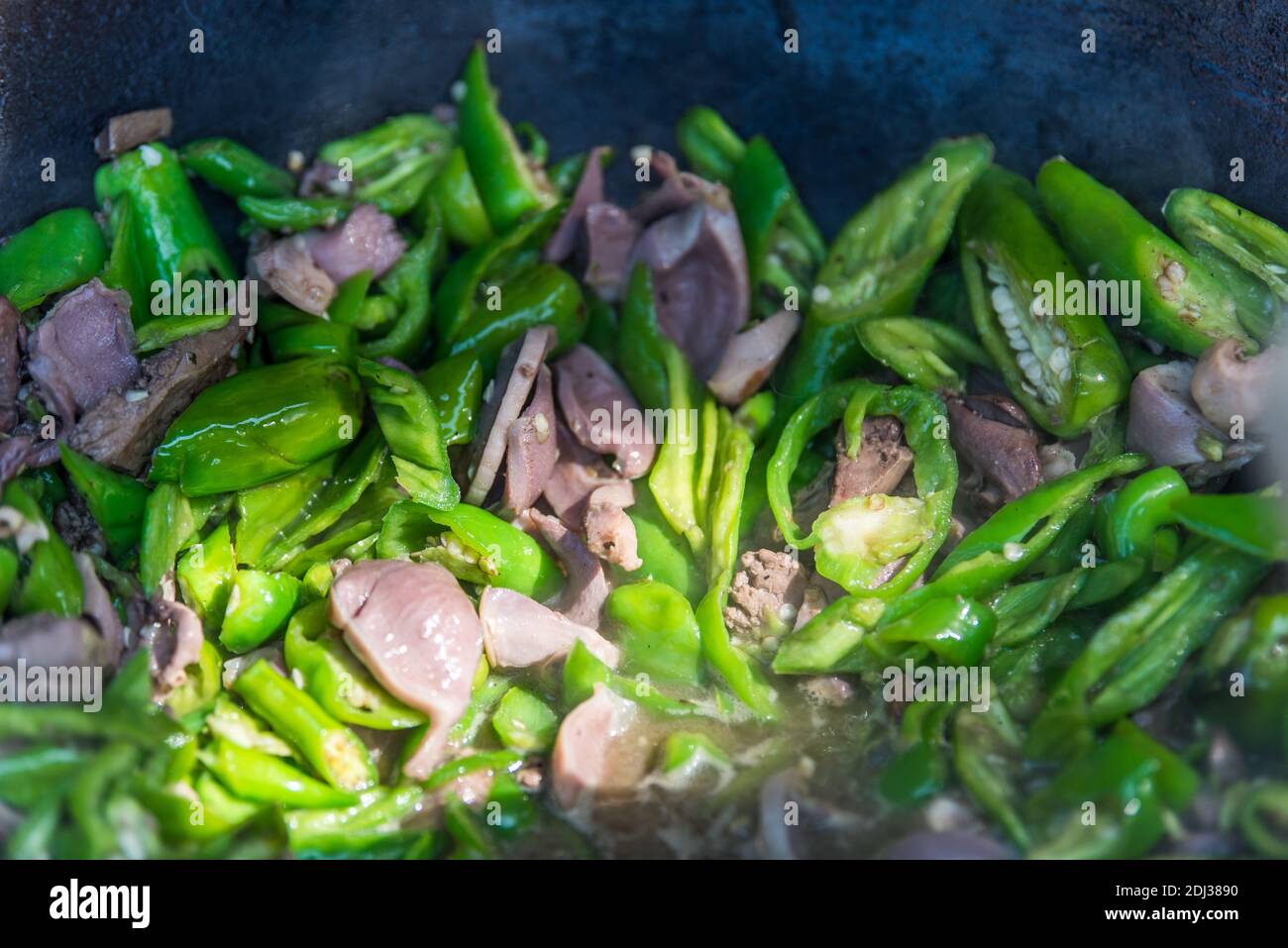 Chinese food, fried green Chili and gizzards in a wok Stock Photo - Alamy