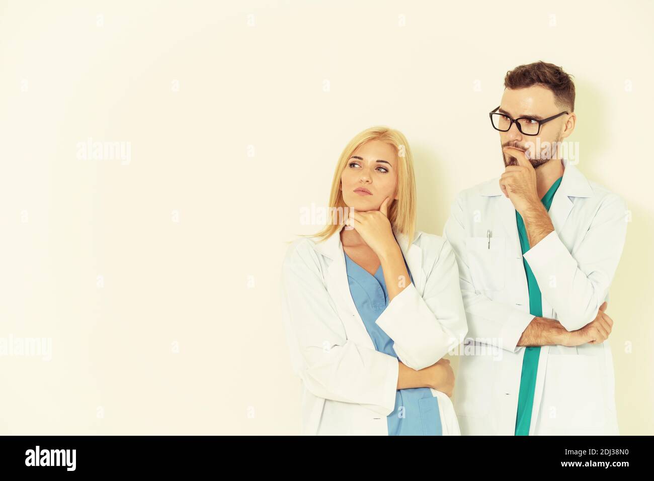 Young doctors coworker thinking on white background. Healthcare and ...