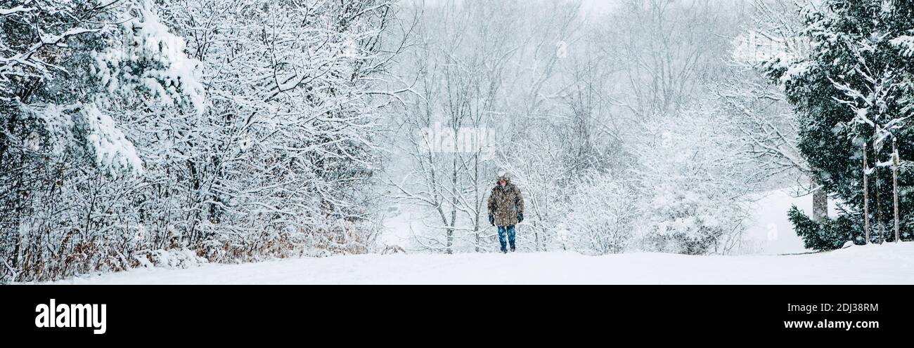Man Walking In Heavy Snowstorm High Resolution Stock Photography and ...