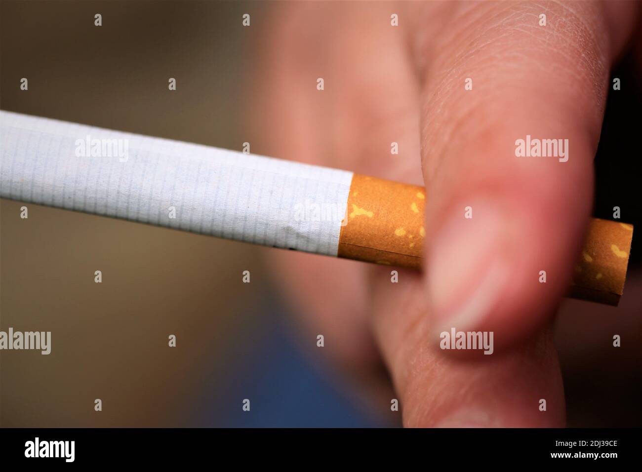 cigarette in hand Stock Photo - Alamy