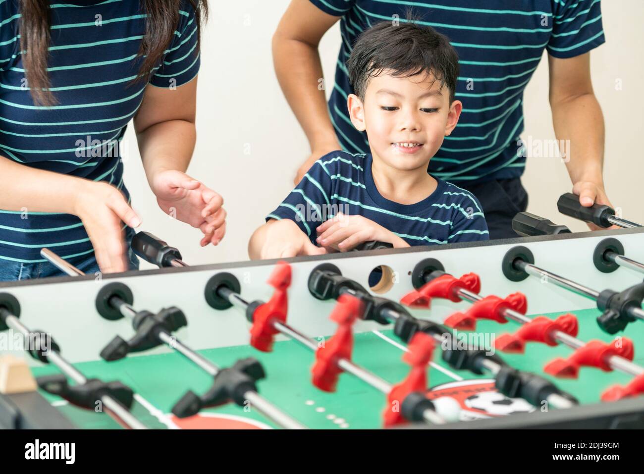 Asian children playing soccer hi-res stock photography and images - Alamy