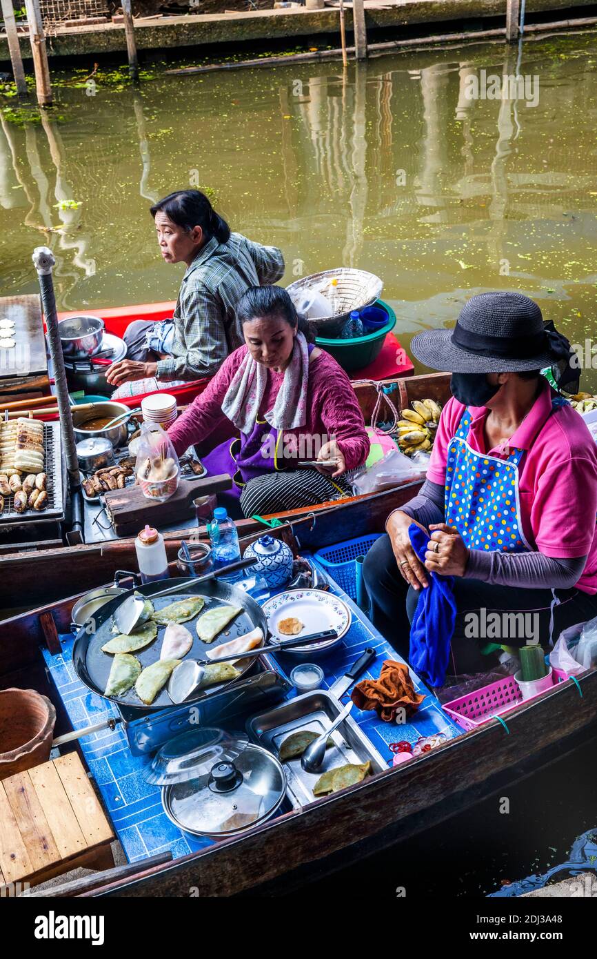 Women aboard san pans cook and serve a variety of snack and entree ...