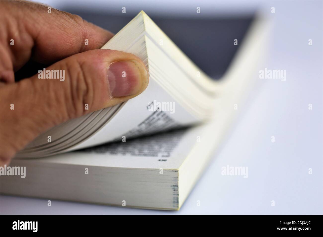 hand with book Stock Photo - Alamy