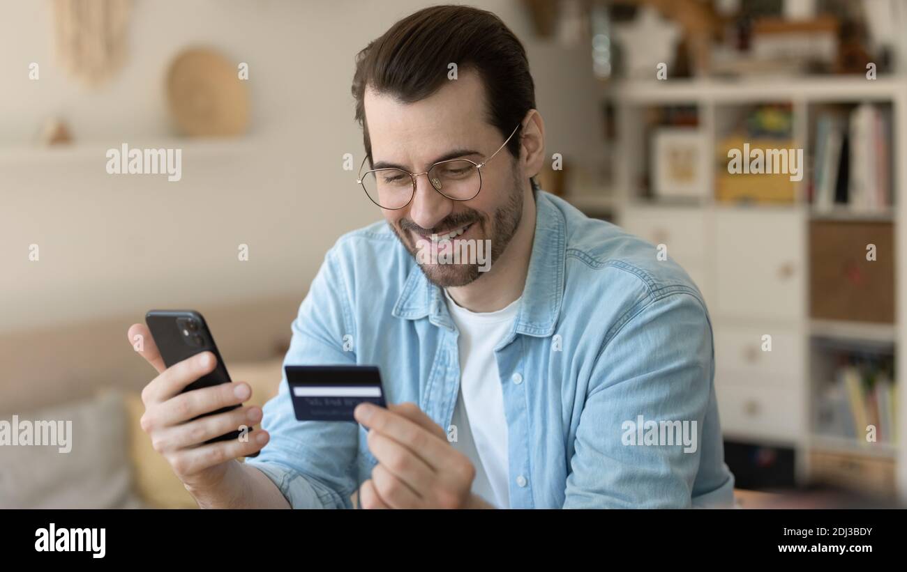 Happy customer making payment hi-res stock photography and images - Alamy