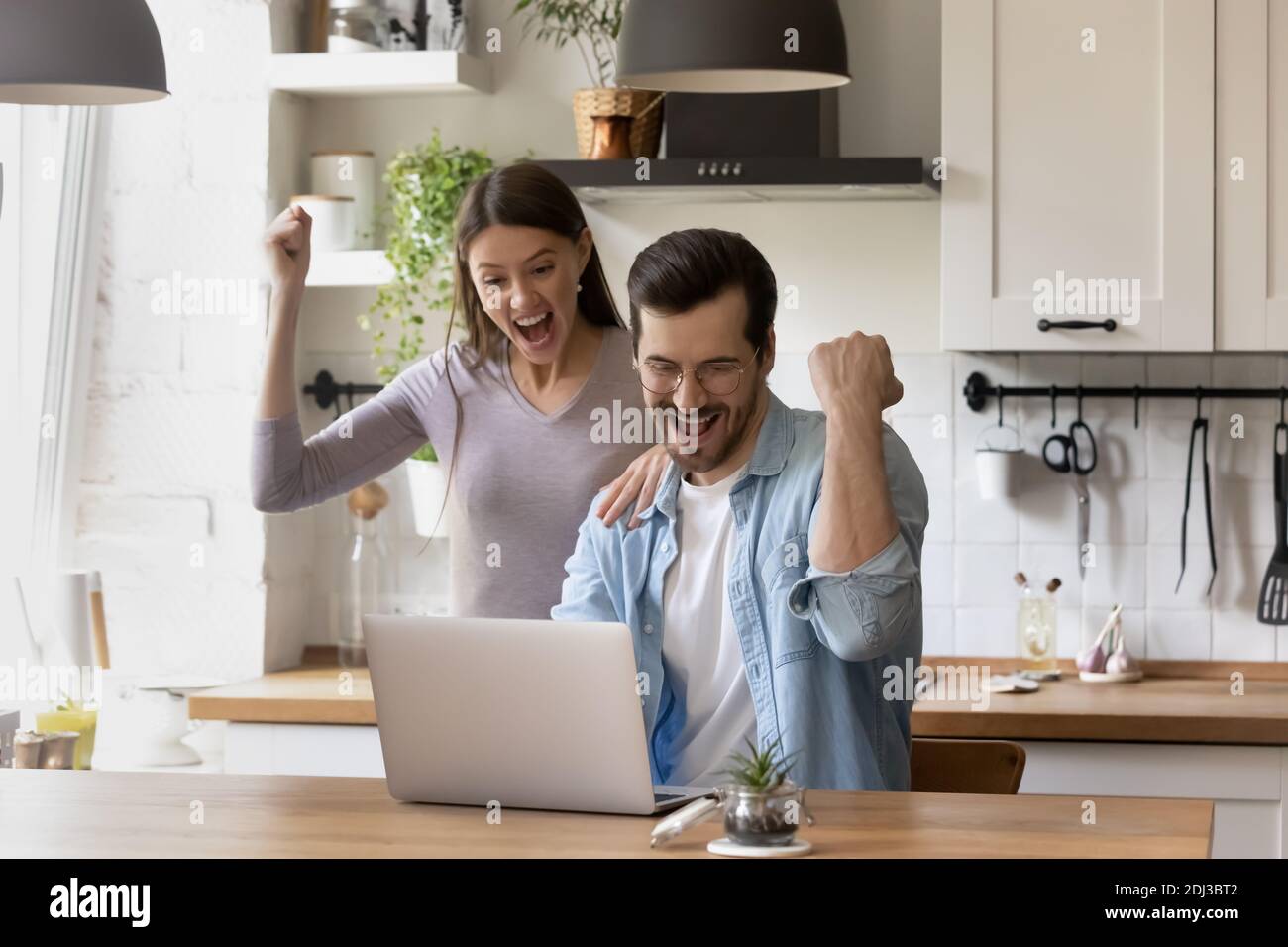 Family celebrating goal home hi-res stock photography and images - Alamy