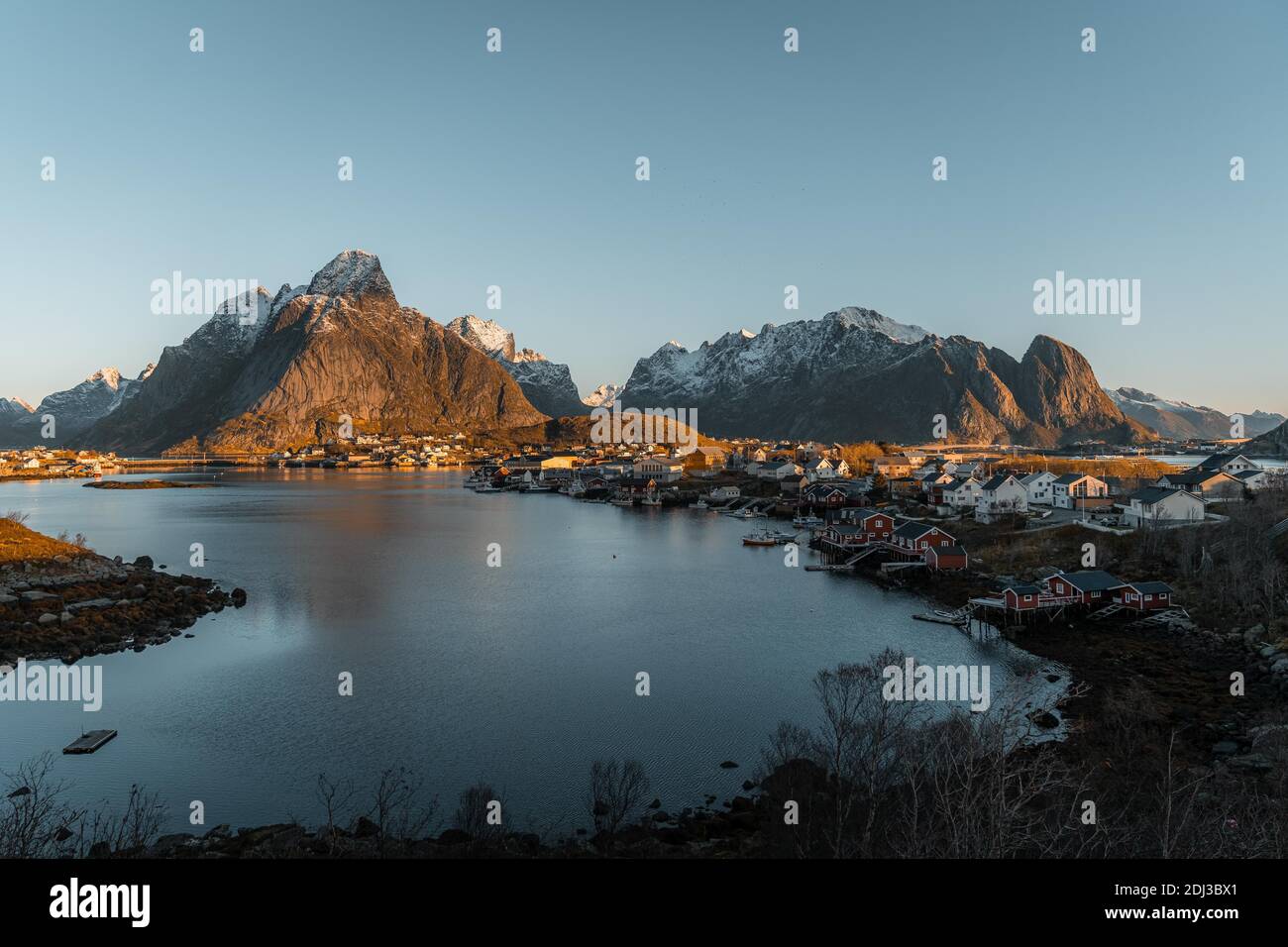 Reine with bringing in fjord at sunrise, colourful cabins, Reine ...