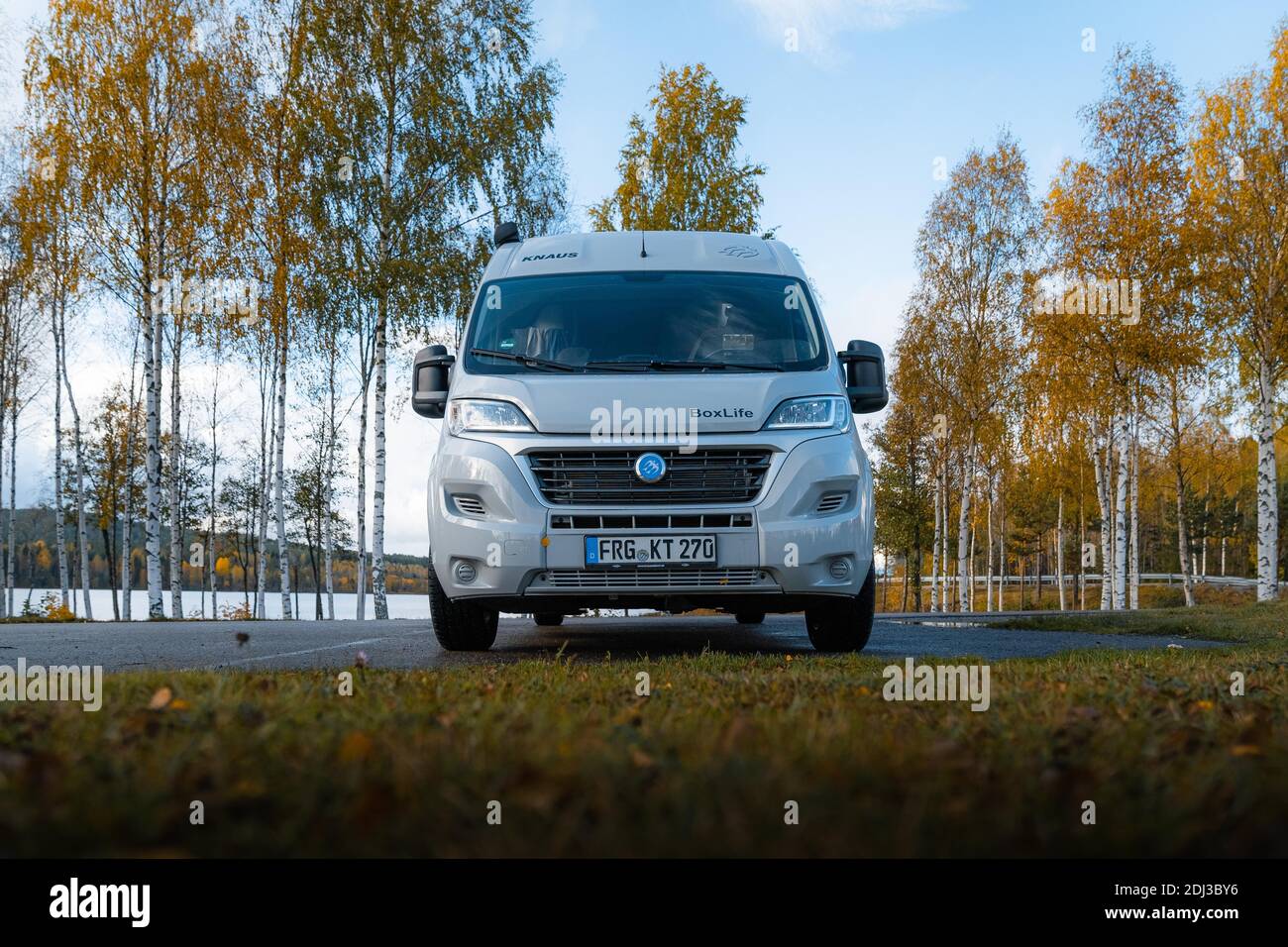 Campervan at resting place in front of autumn birch trees and lake, resting places Angersjoen ...