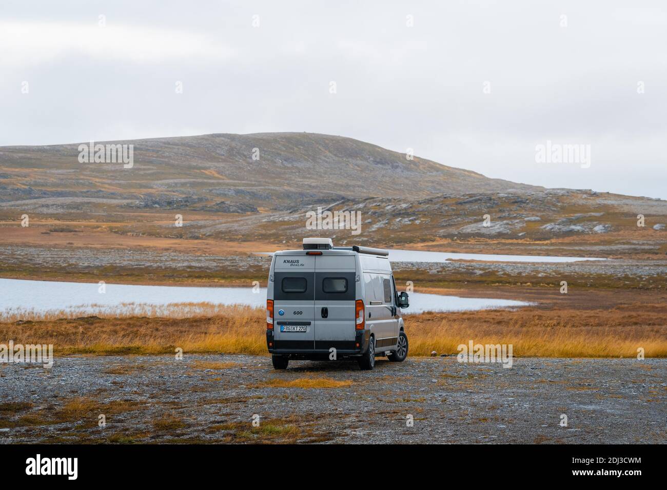 Campervan with rear view stands on parking lot near Kafjord, North Cape ...