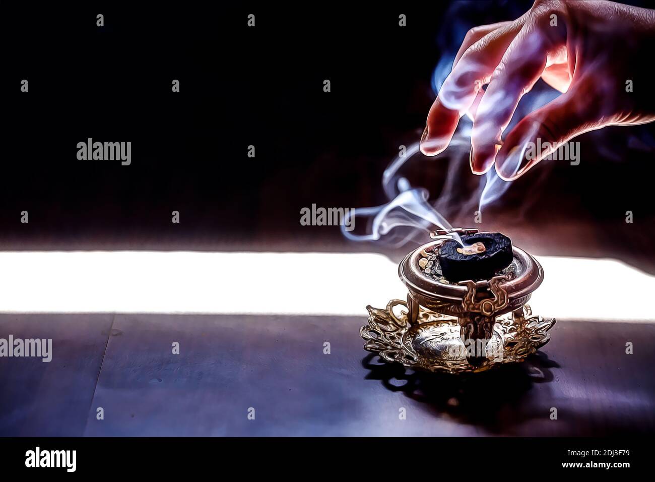 incense in a woman hand, incense smoke, painting effect Stock Photo - Alamy