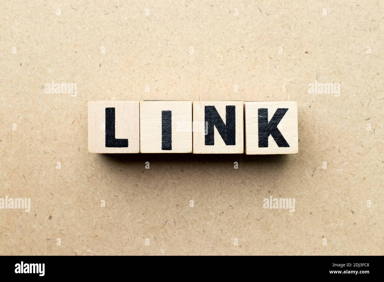 Letter block in word link on wood background Stock Photo - Alamy